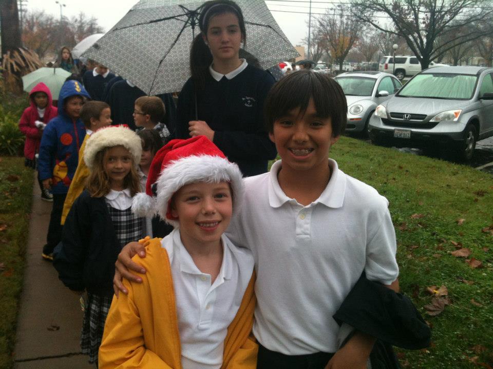 1st and 7th Grade Buddies Caroling - St. Ignatius Parish School